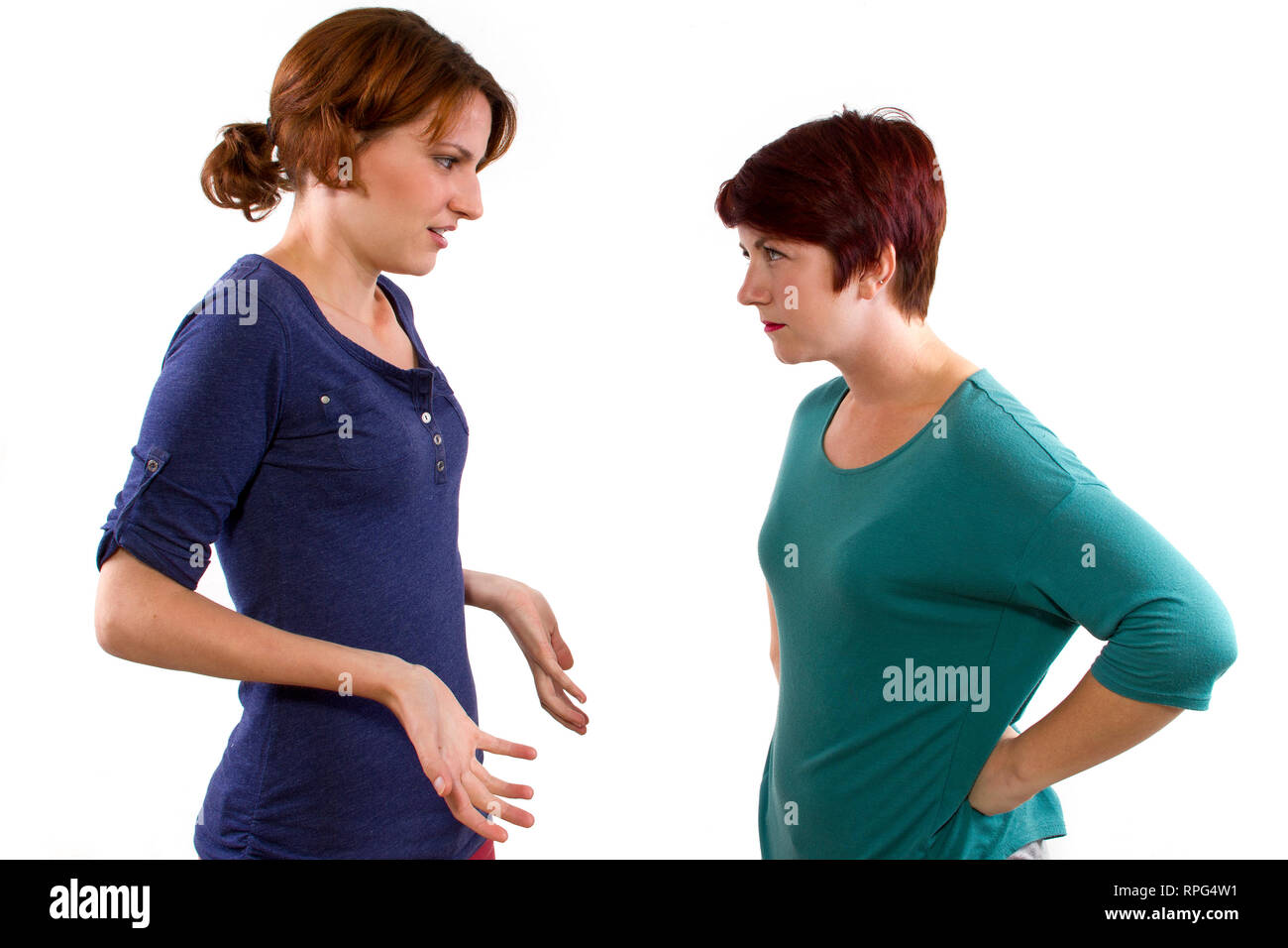 two Caucasian women arguing and distrusting each other Stock Photo - Alamy