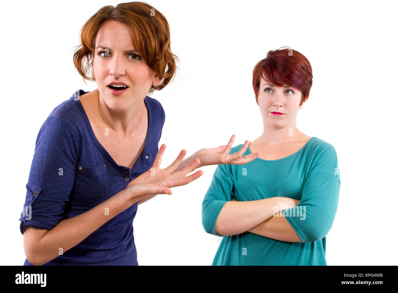 two Caucasian women arguing and distrusting each other Stock Photo - Alamy