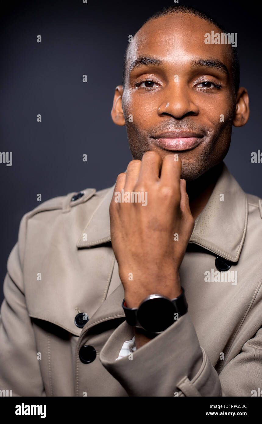 Fashionable male model wearing fall fashion style beige coat with ...