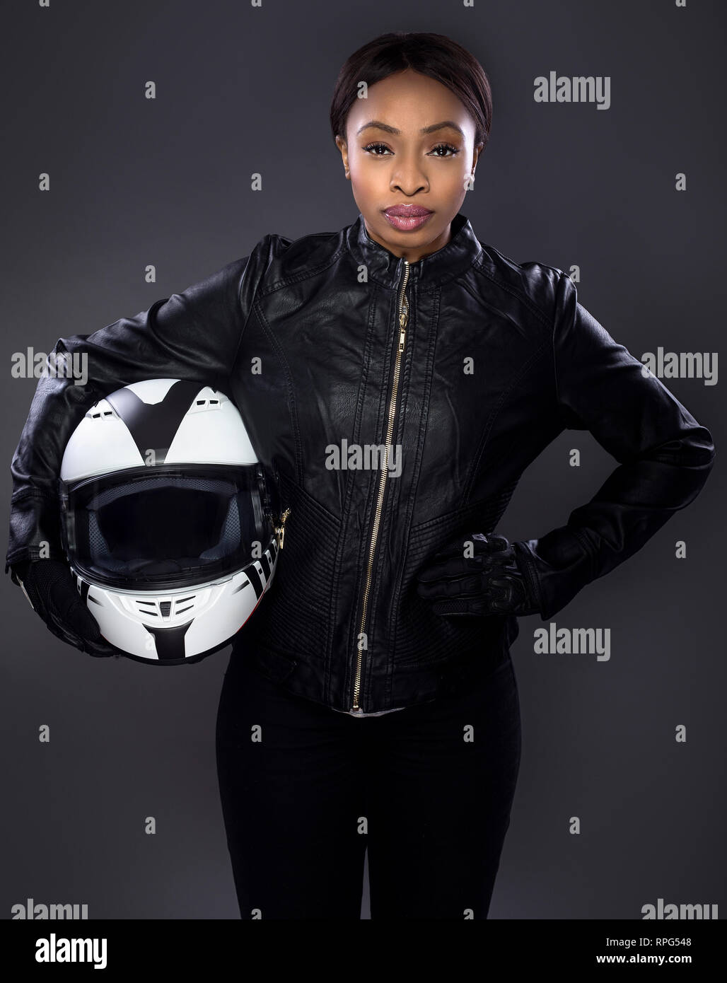 Black female motorcycle biker or race car driver or stuntwoman wearing ...