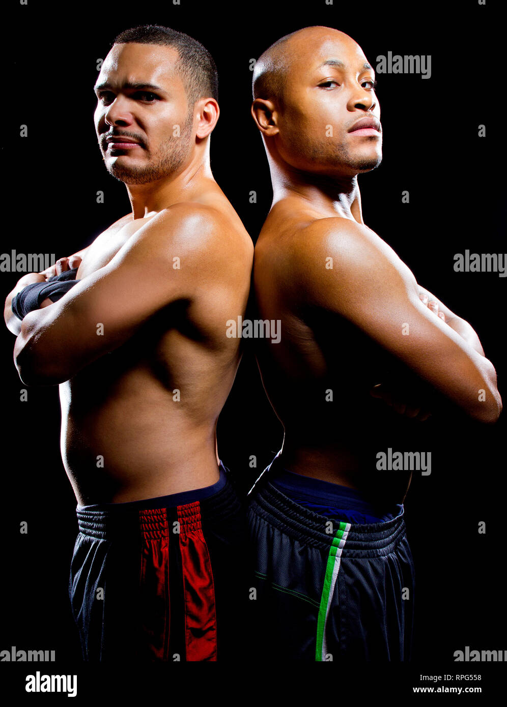 black boxer posing with latino opponent on a black background Stock ...