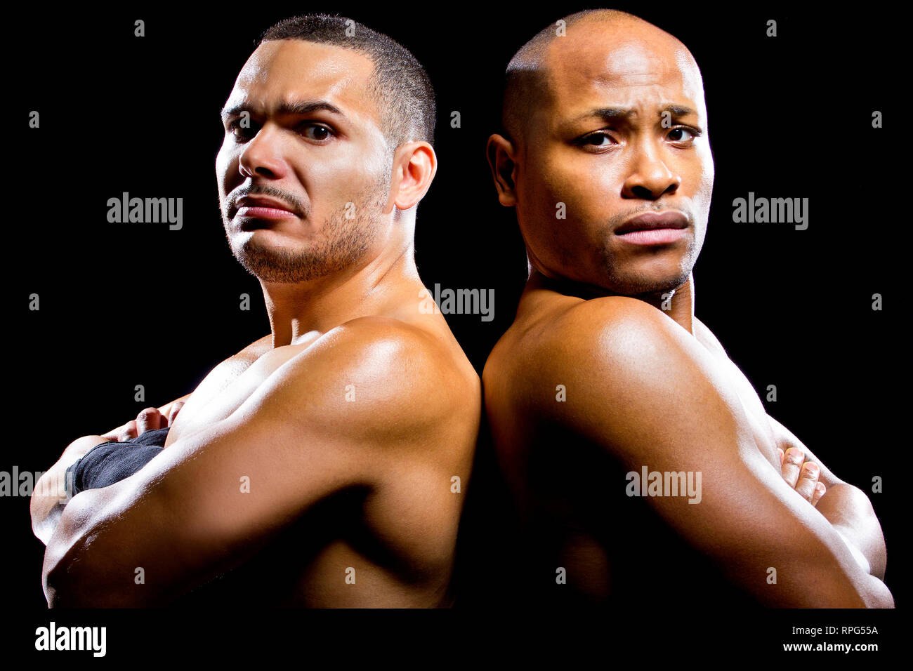 black boxer posing with latino opponent on a black background Stock ...