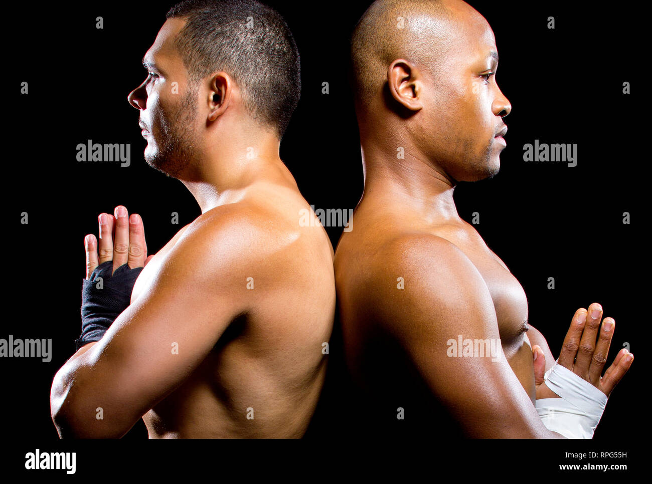 black boxer posing with latino opponent on a black background Stock ...