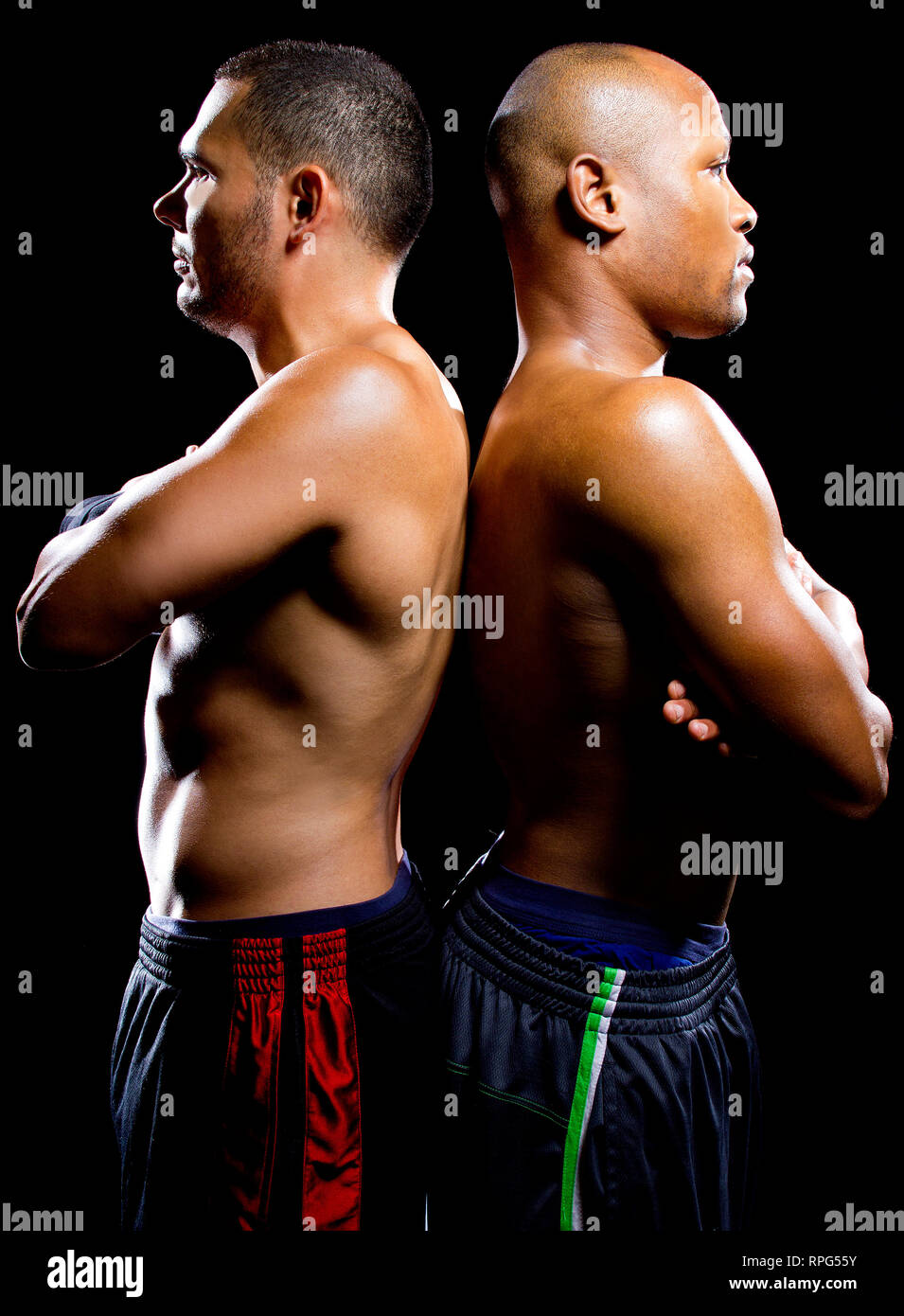 black boxer posing with latino opponent on a black background Stock ...