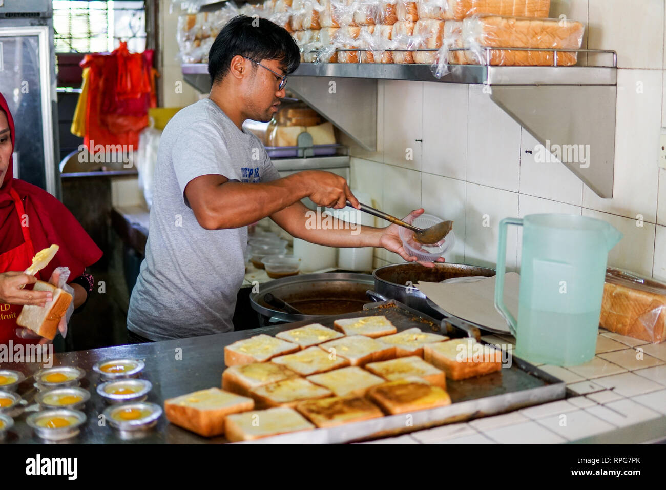 JOHOR, MALAYSIA - FEBRUARY 2019 : Workers preparing the "kacang pool ...