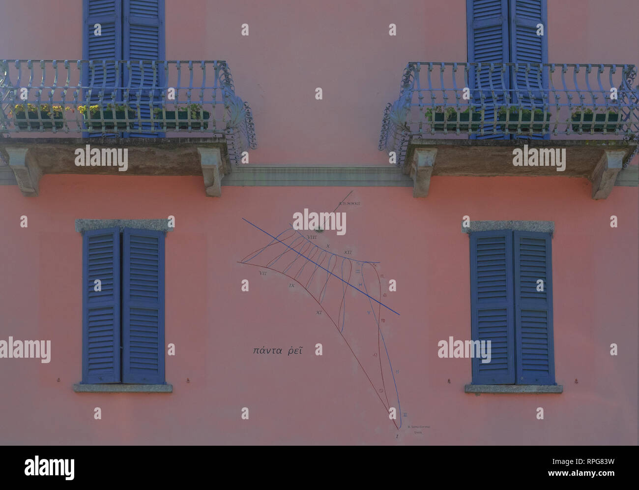solar sundial on the facade of an old country house, Italy Stock Photo ...