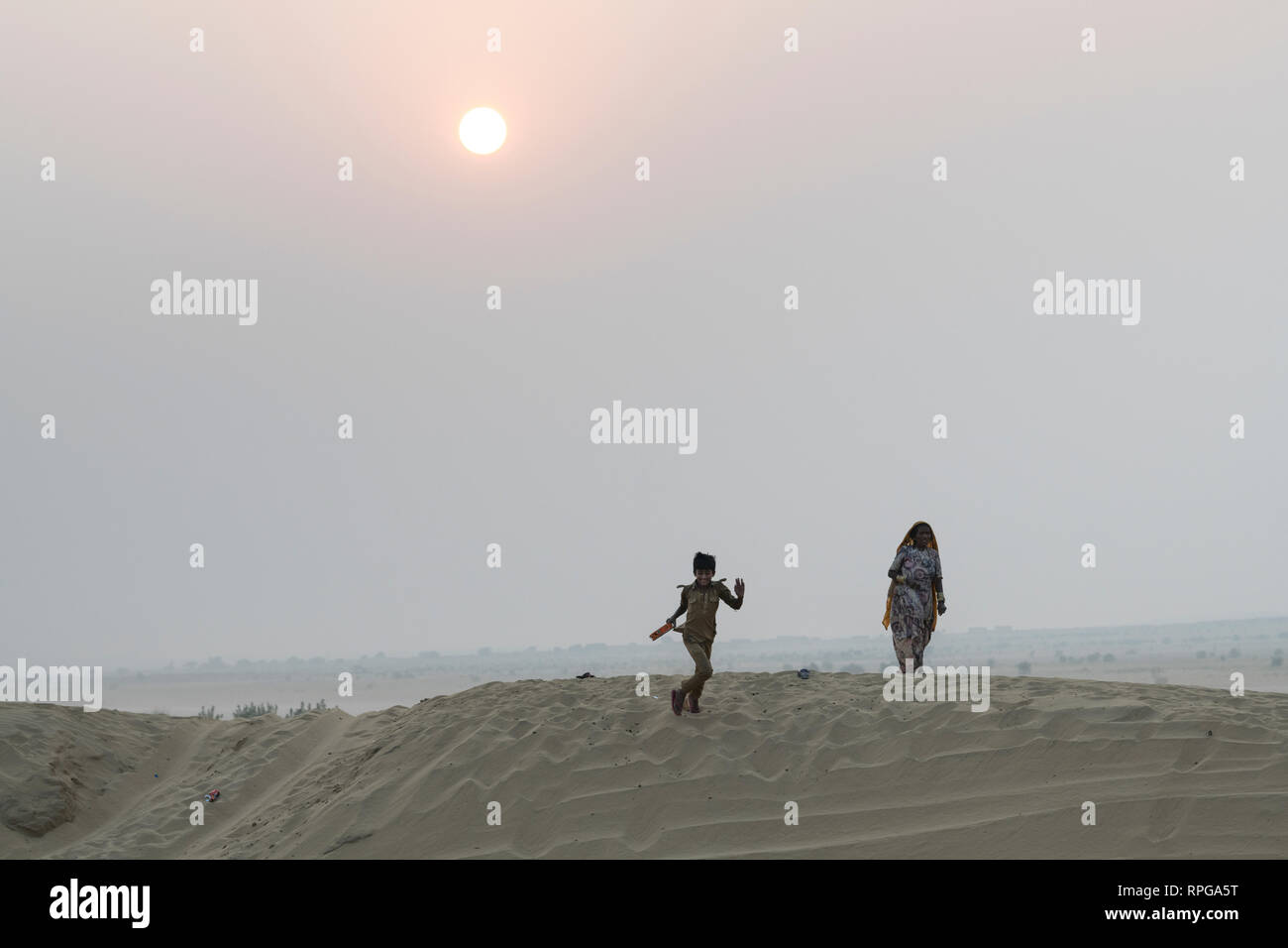 Boy running in desert, Damodara, Thar Desert, Rajasthan, India Stock ...