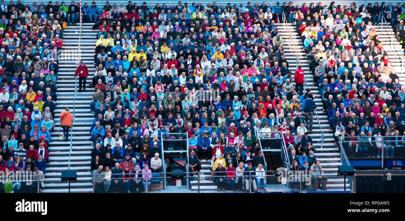 Edinburgh, Scotland - August 12, 2010: Crowd attending a parade sitting ...