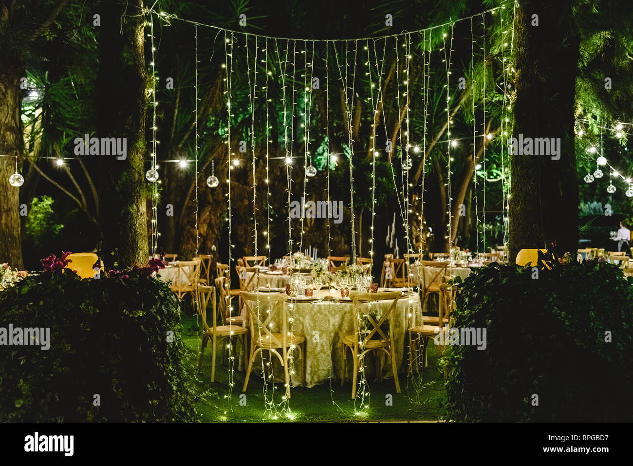 Beautiful decoration for a night wedding, illuminated with led lanterns ...