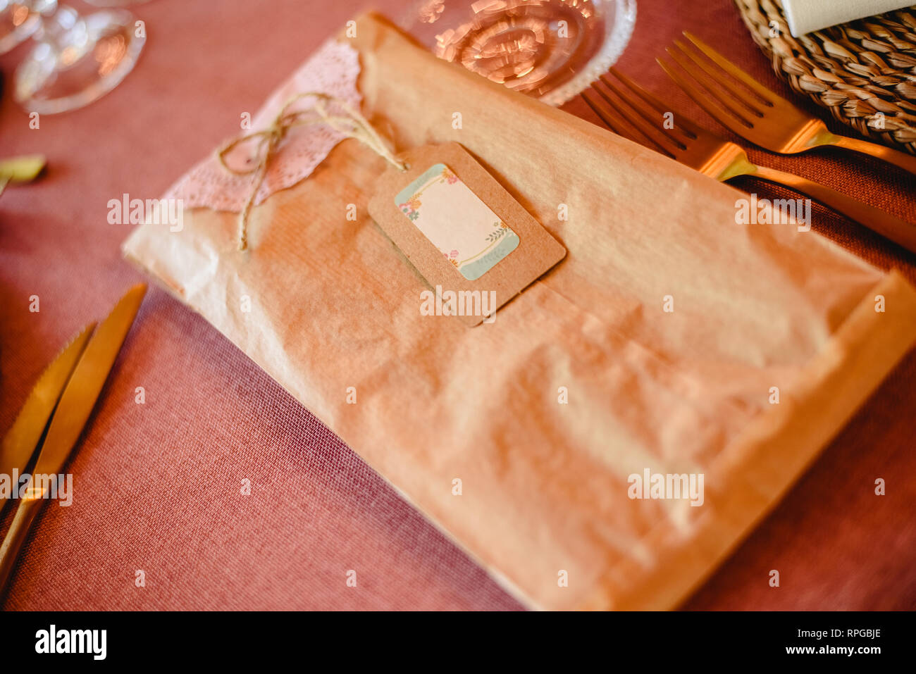Rectangular gift wrapped in paper with empty label to fill, copy space ...