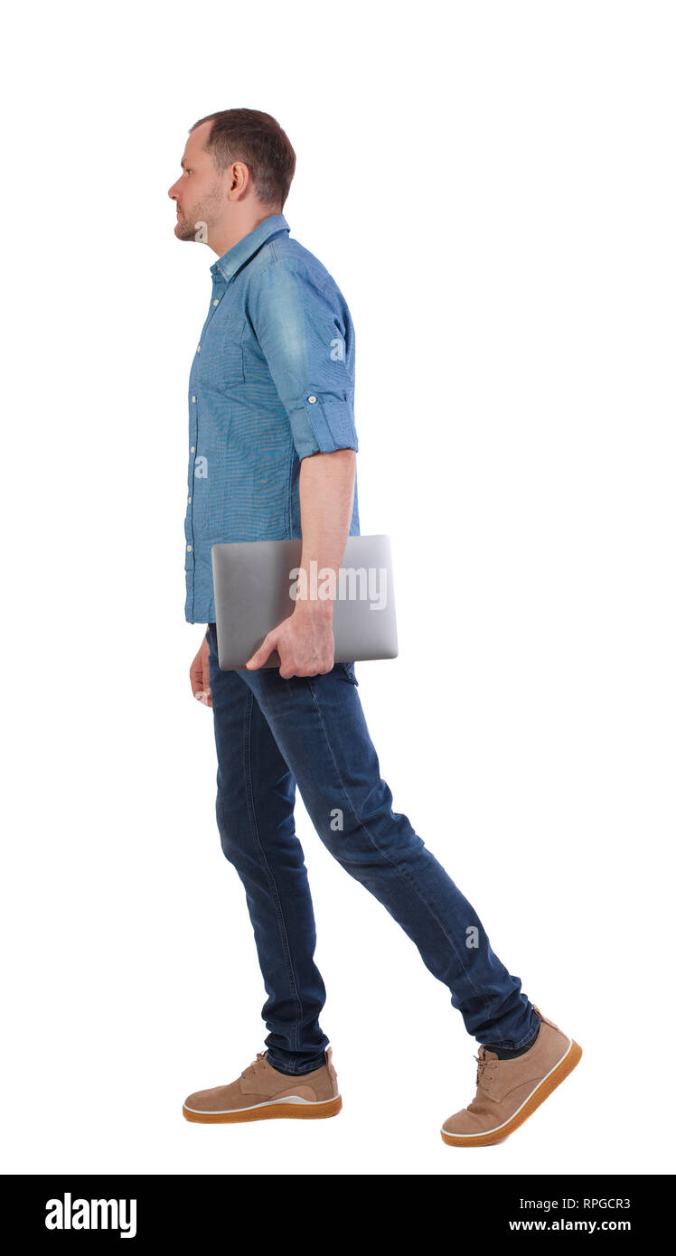 Back view of a walking man with a laptop. Rear view people collection ...