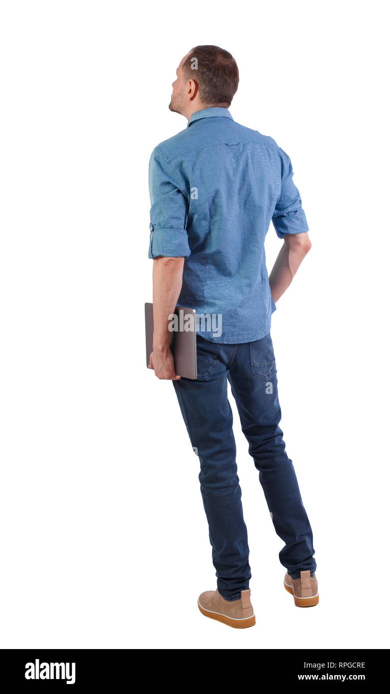 Back view of a man who is standing with a laptop. Rear view people ...