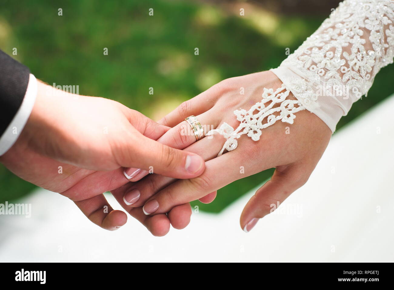 Beautiful bride wedding details as a background, hand in hand Stock ...