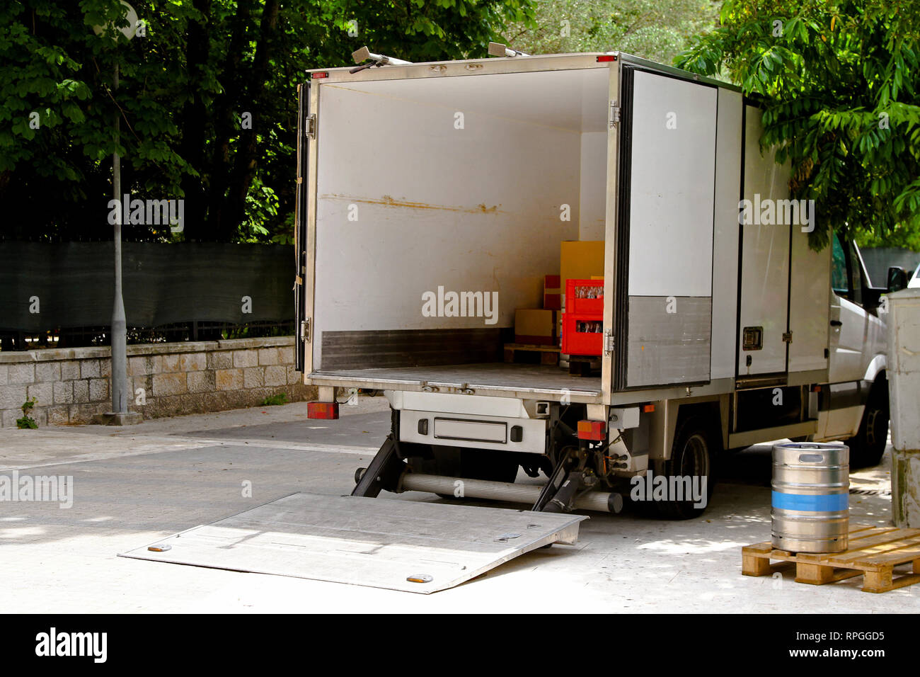Commercial goods delivery van with lift ramp Stock Photo - Alamy