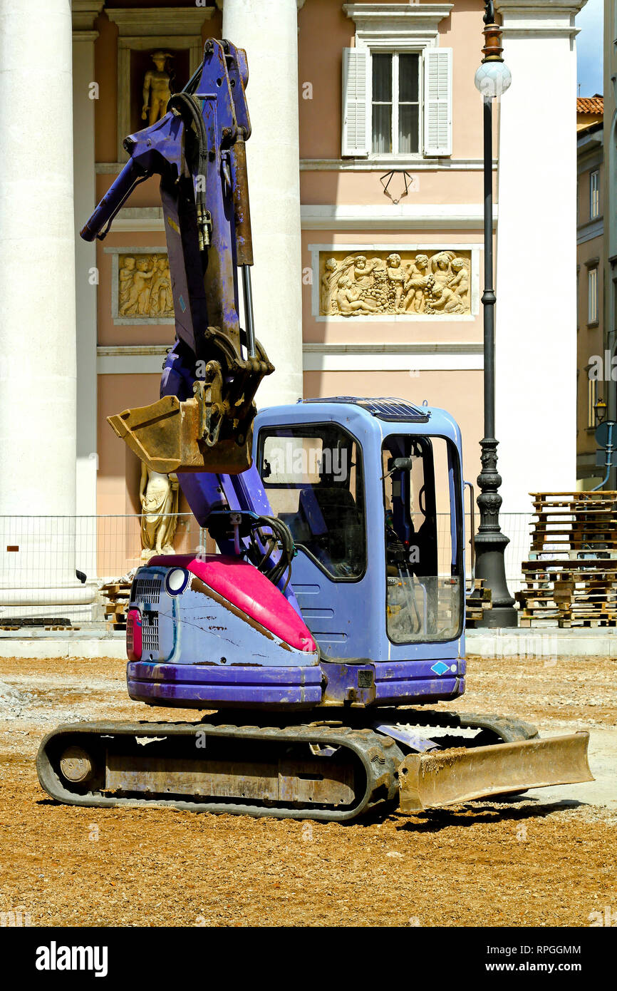 Small purple excavator machinery for street construction Stock Photo ...