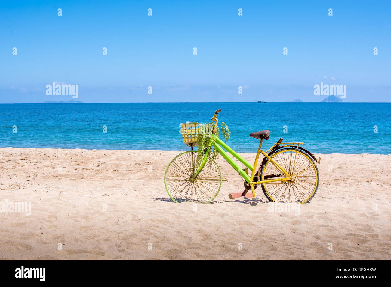 isolated classic bicycle with front basket on the beach Stock Photo - Alamy