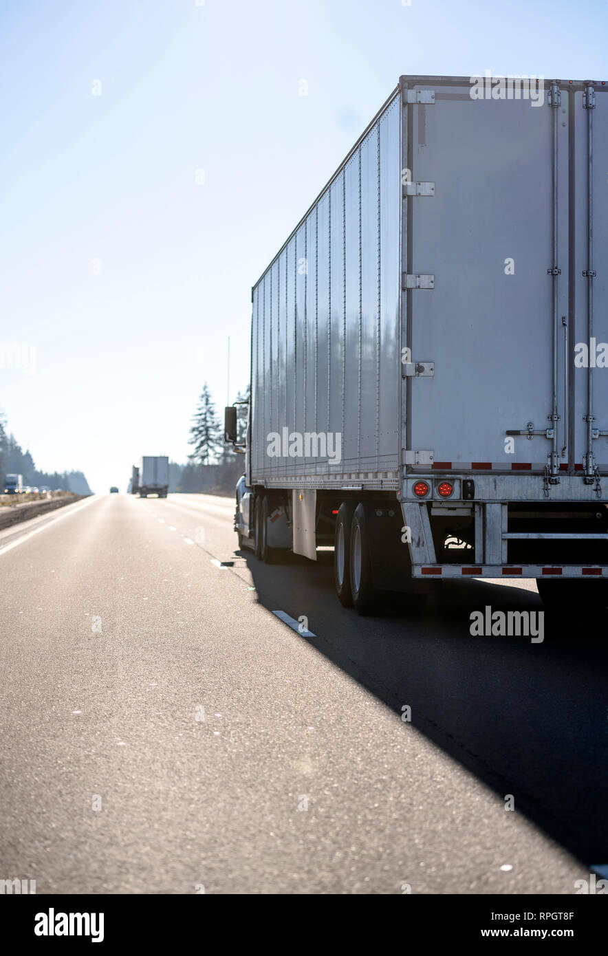 Back view of convoy of professional logistic freight transportation ...
