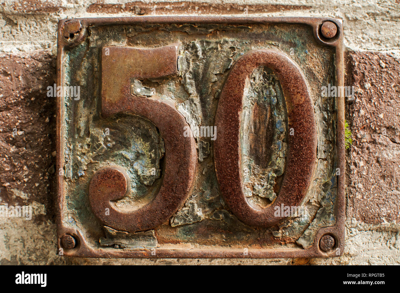 Old retro weathered cast iron plate with number 50 closeup Stock Photo ...