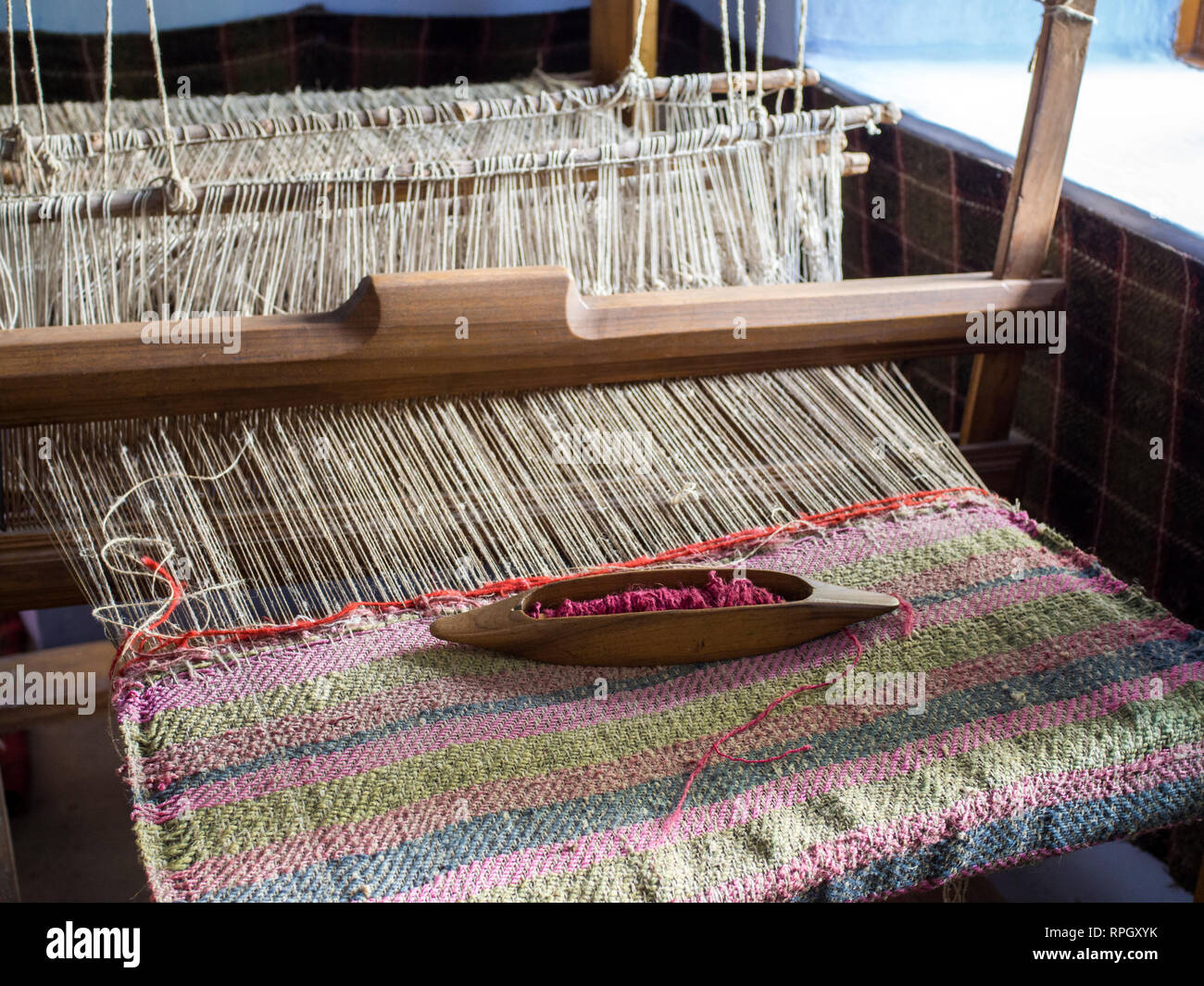 A loom set up in a traditional cottage in Old Orhei to show how people ...