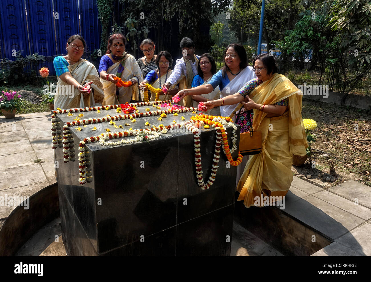 Indian Men and Women are seen paying a Floral Tribute at the Martyr ...