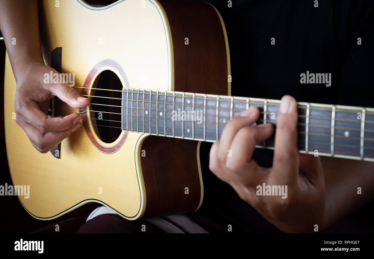Mans hand playing acoustic guitar hi-res stock photography and images ...
