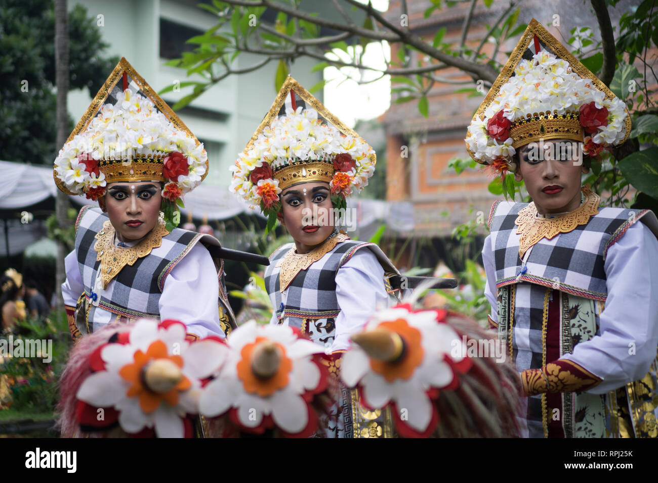 Balinese dancers in traditional attire perform the sacred Baris dance ...