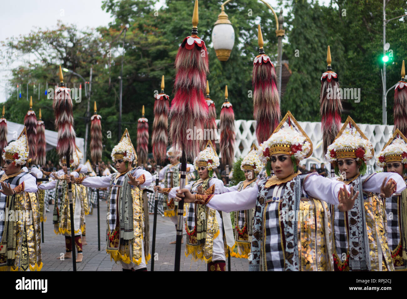 Balinese dancers in traditional attire perform the sacred Baris dance ...