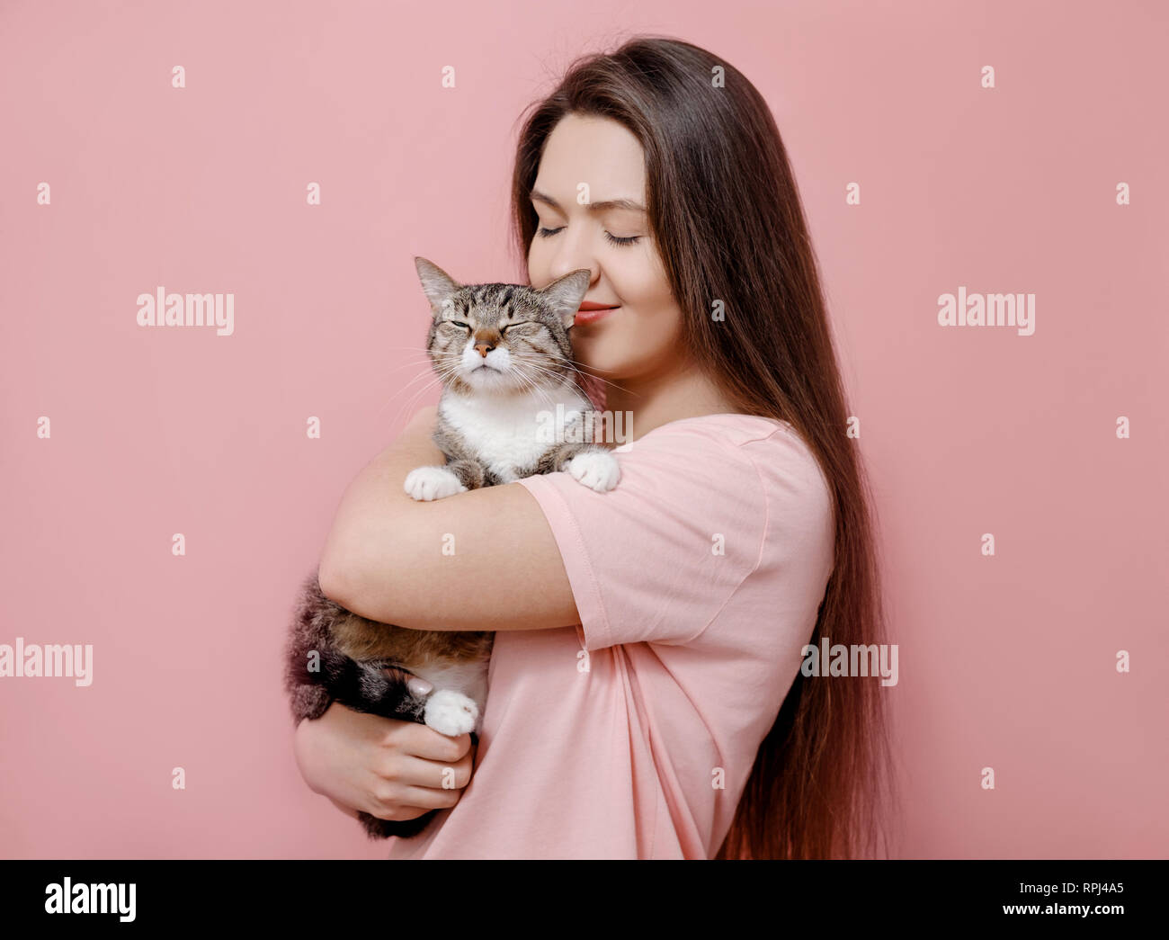 Hugging her cat hi-res stock photography and images - Alamy