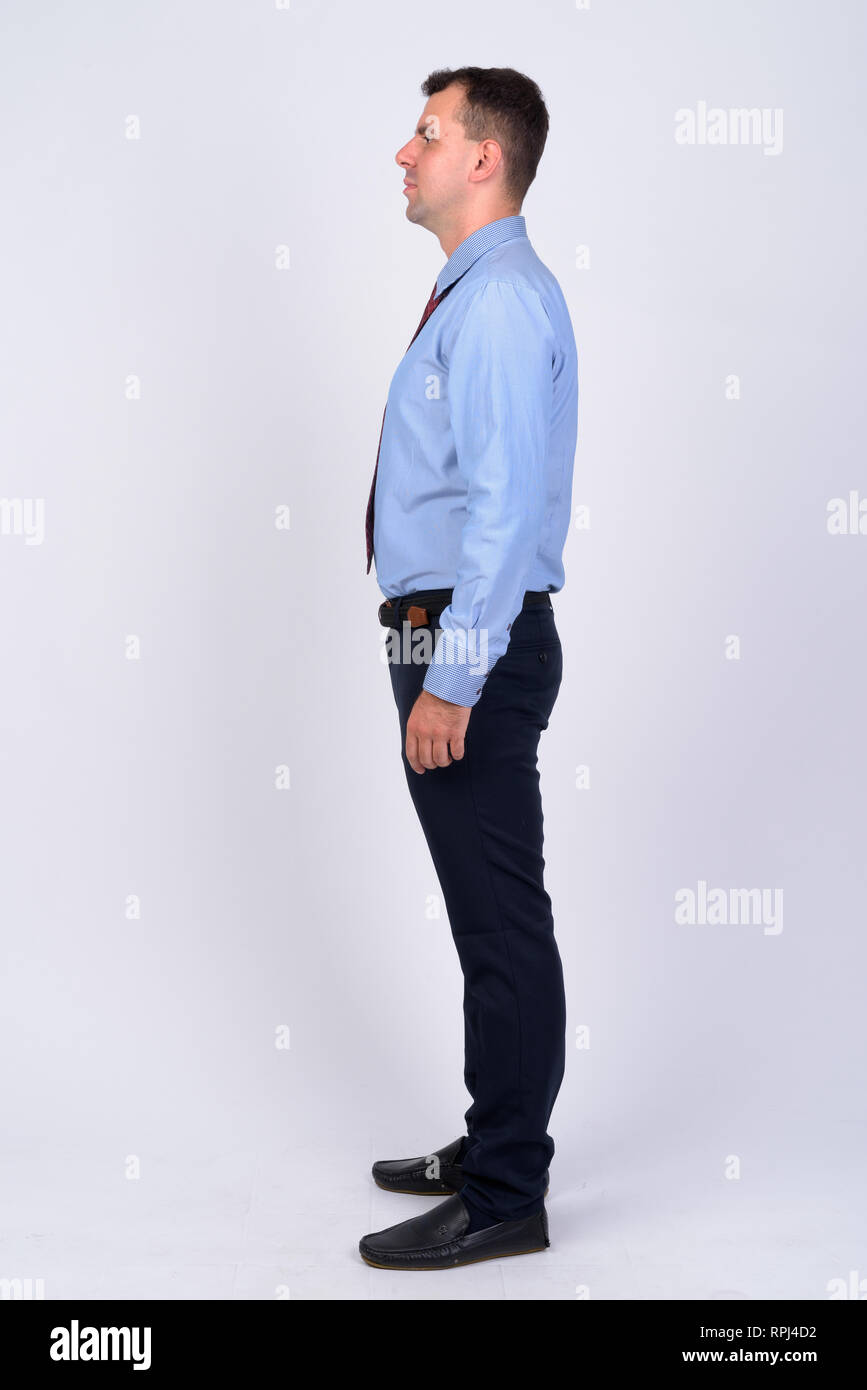 Full body shot profile view of businessman Stock Photo - Alamy