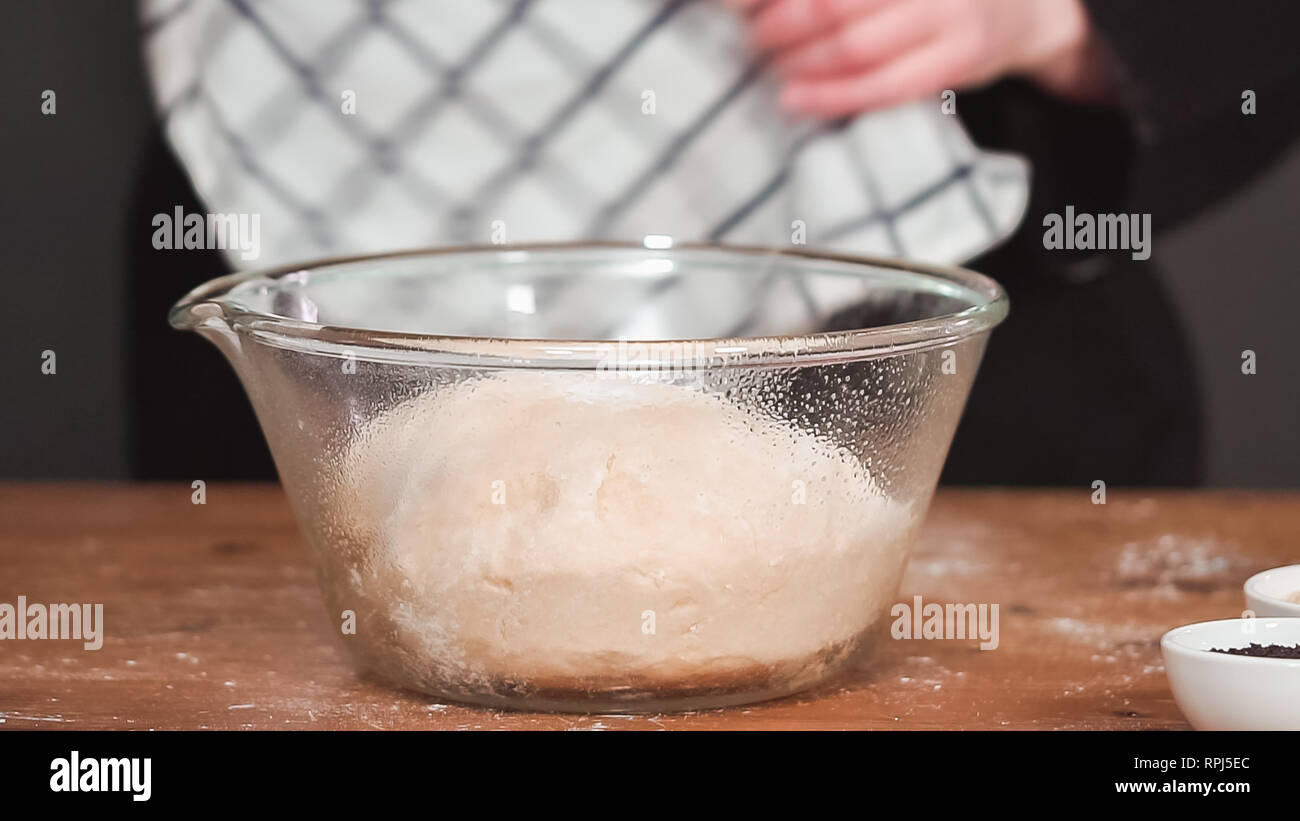 Step by step. Dough set to rise in a large glass mixing bowl and ...