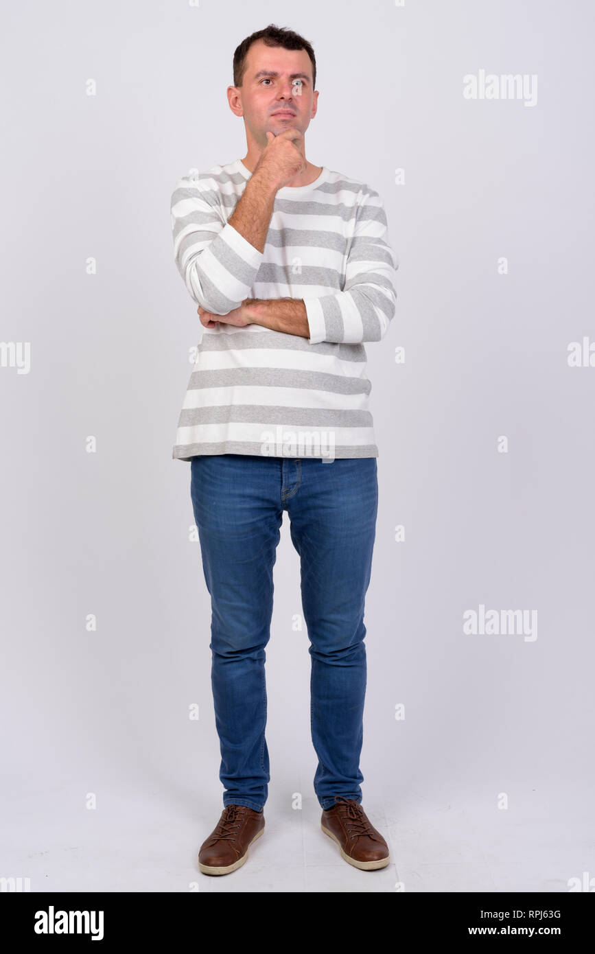 Full body shot of man thinking against white background Stock Photo - Alamy