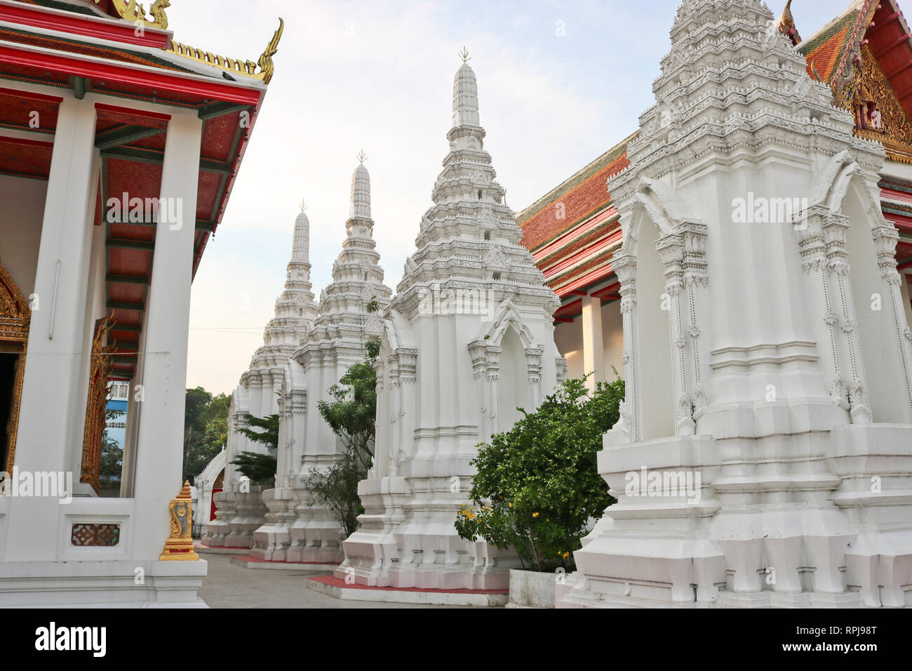 Beautiful buddhist wat temple with white tombs Stock Photo - Alamy