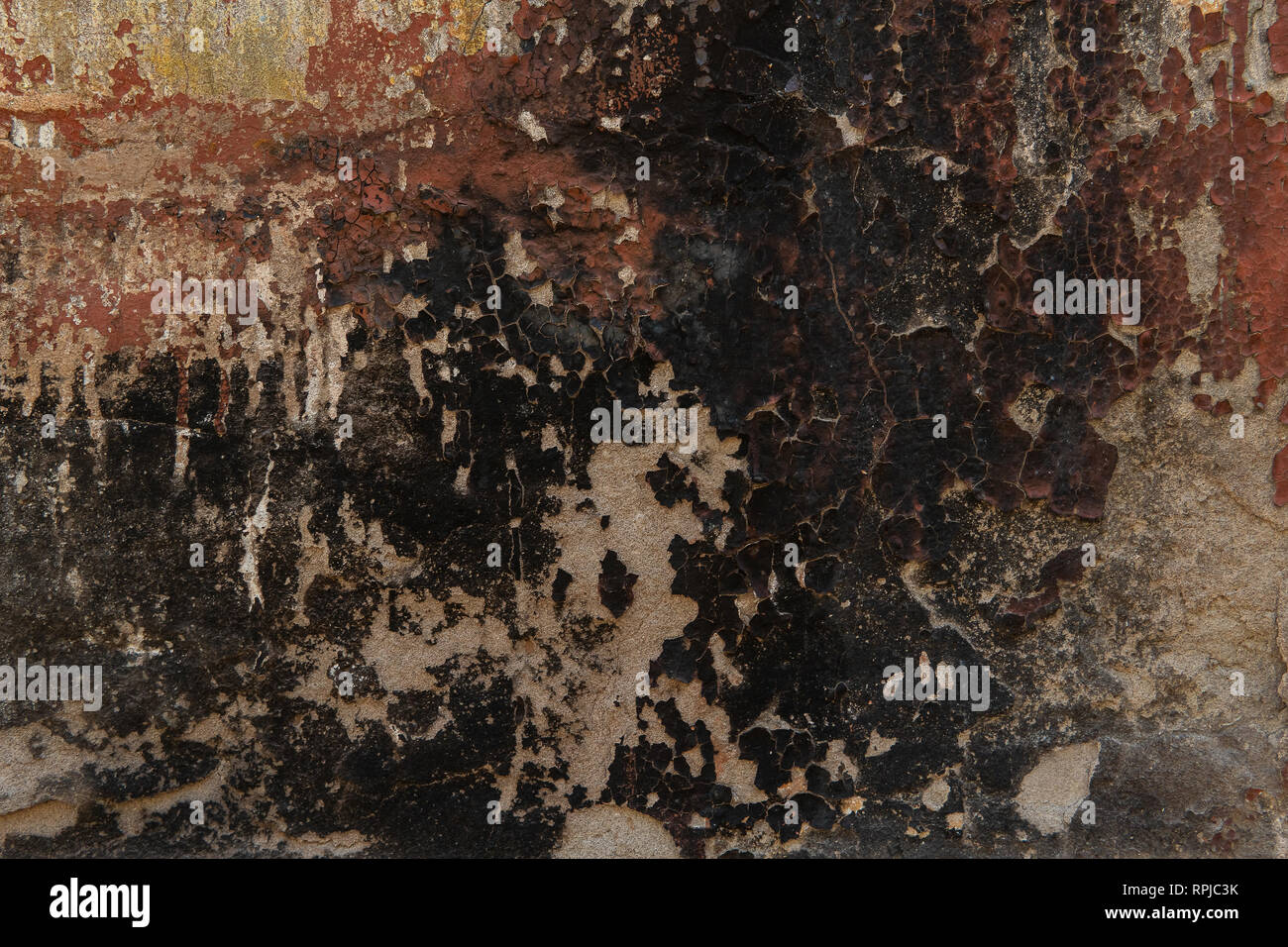 burnt red wall background with withered paint. Old plaster texture ...