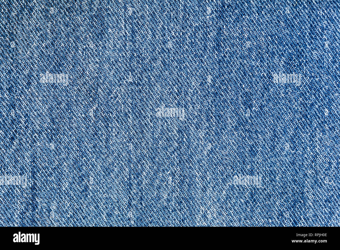 Blue denim fabric closeup Stock Photo - Alamy