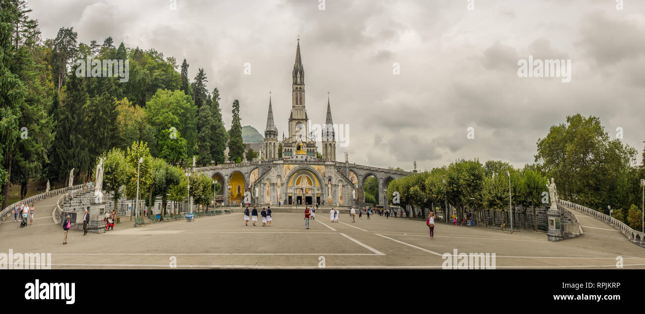 FRANCE LOURDES SEP 2018 view of basilica in Lourdes town. The town is a ...