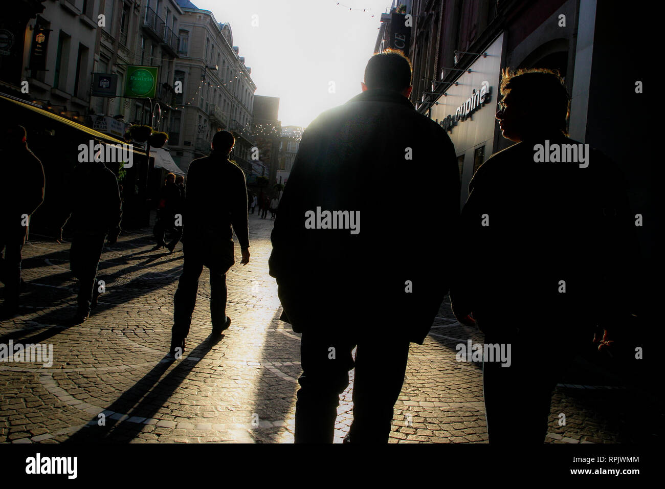 Human silhouettes in a backlight, pedestrian street, Lille, Nord ...