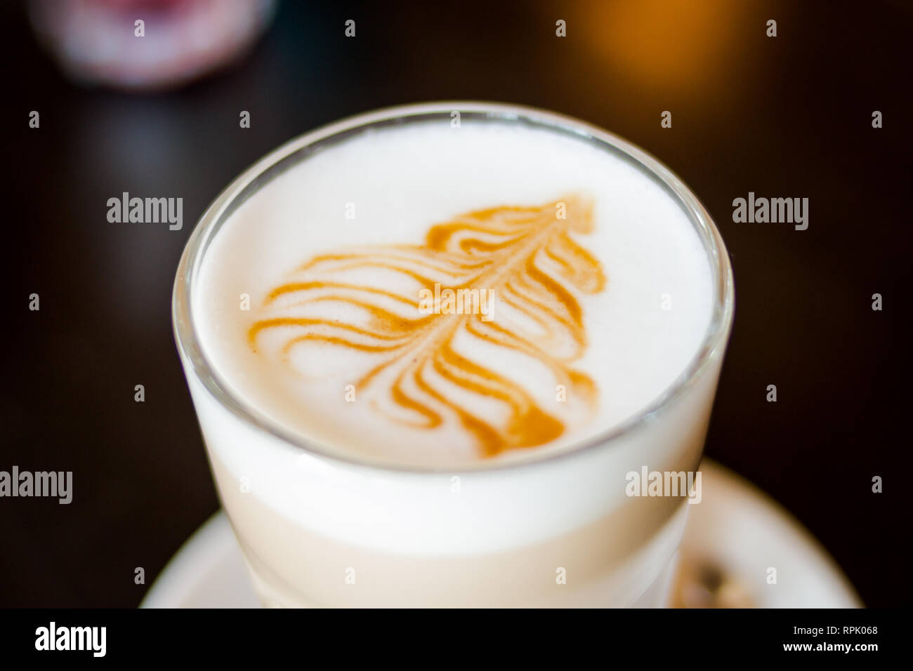 Fancy latte coffee in glass jar.Glass cup of hot coffee latte isolated ...
