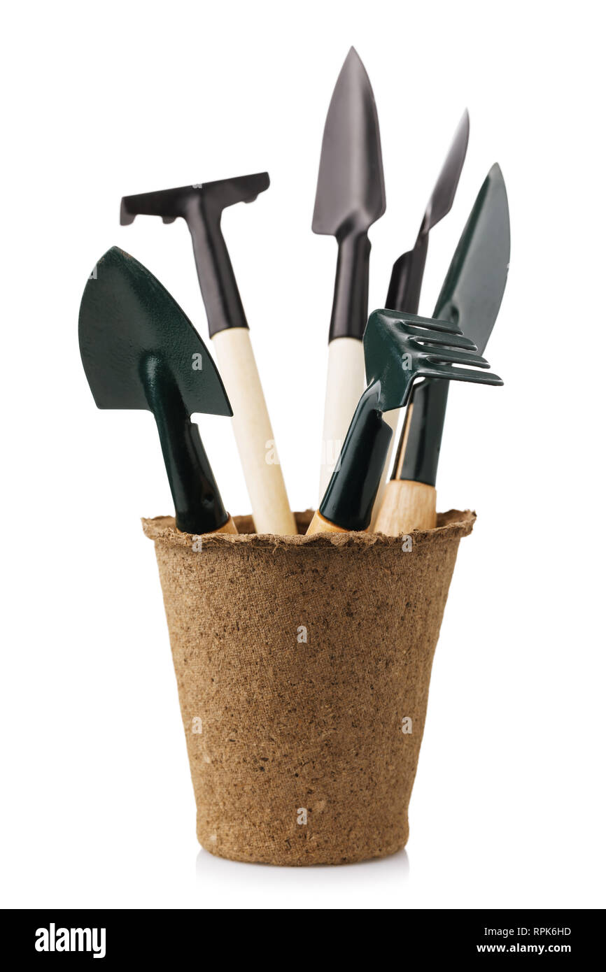 Garden tools in peat pot isolated on white background Stock Photo - Alamy