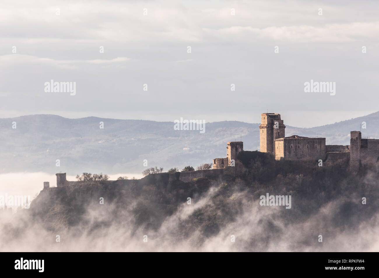 A view of Rocca Maggiore castle in Assisi (Umbria, Italy) in the middle ...