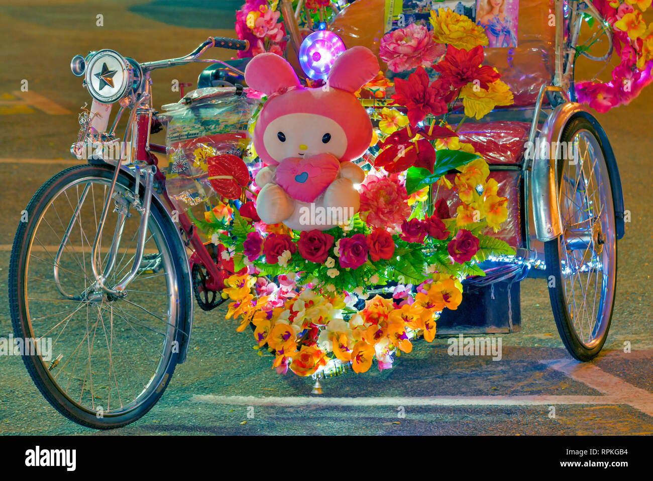 the colorful trishaws, a form of bicycle-powered rickshaw, that cruise ...