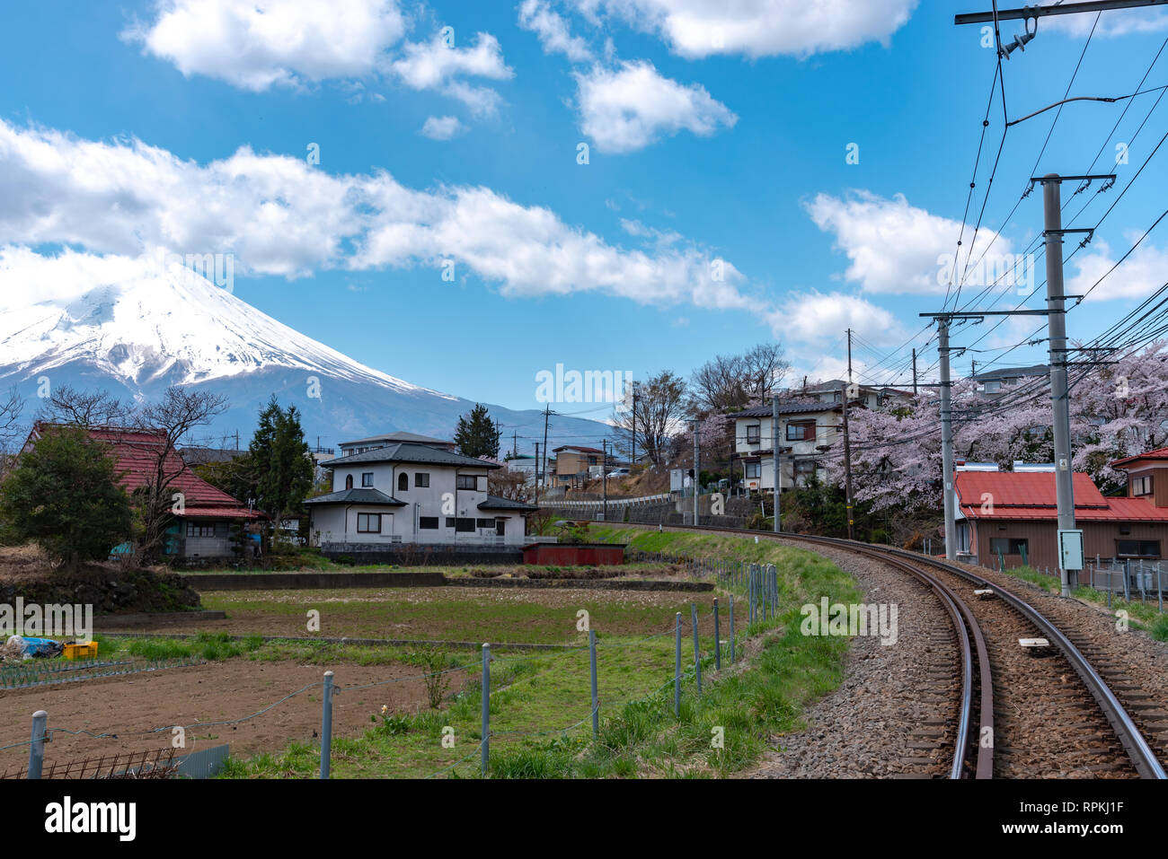 Fujikyu Railway train railroad track with snow covered Mount Fuji ( Mt ...