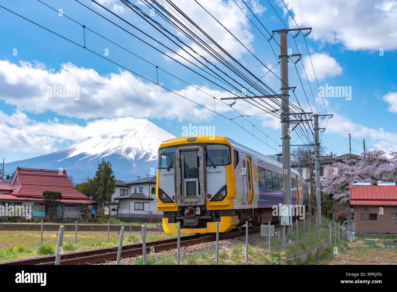 Fujikyu Railway train railroad track with snow covered Mount Fuji ( Mt ...