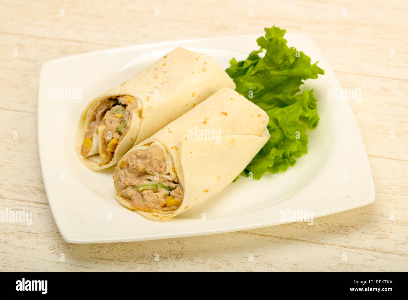 Tuna bread roll with salad leaves Stock Photo - Alamy