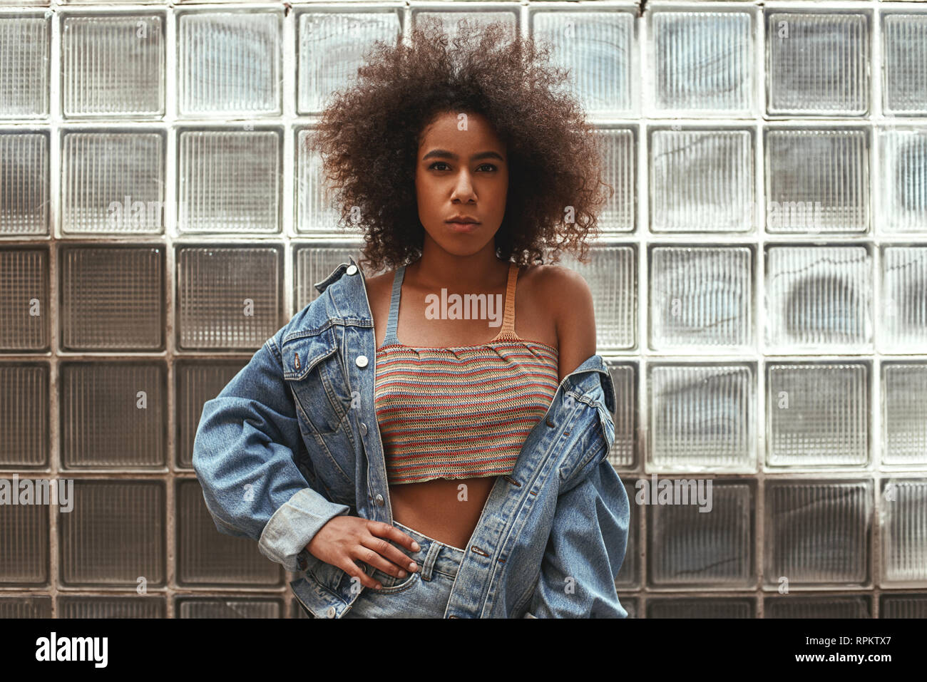 Standing beauty fashion model hand on hip looking at camera hi-res ...