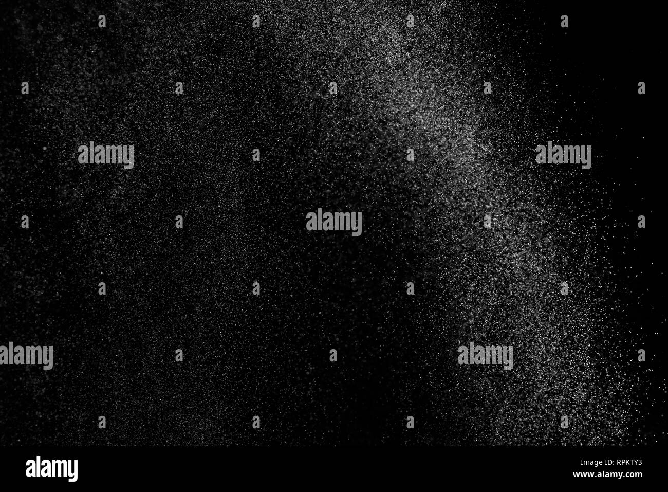 Abstract splashes of water on black background. Freeze motion of white ...