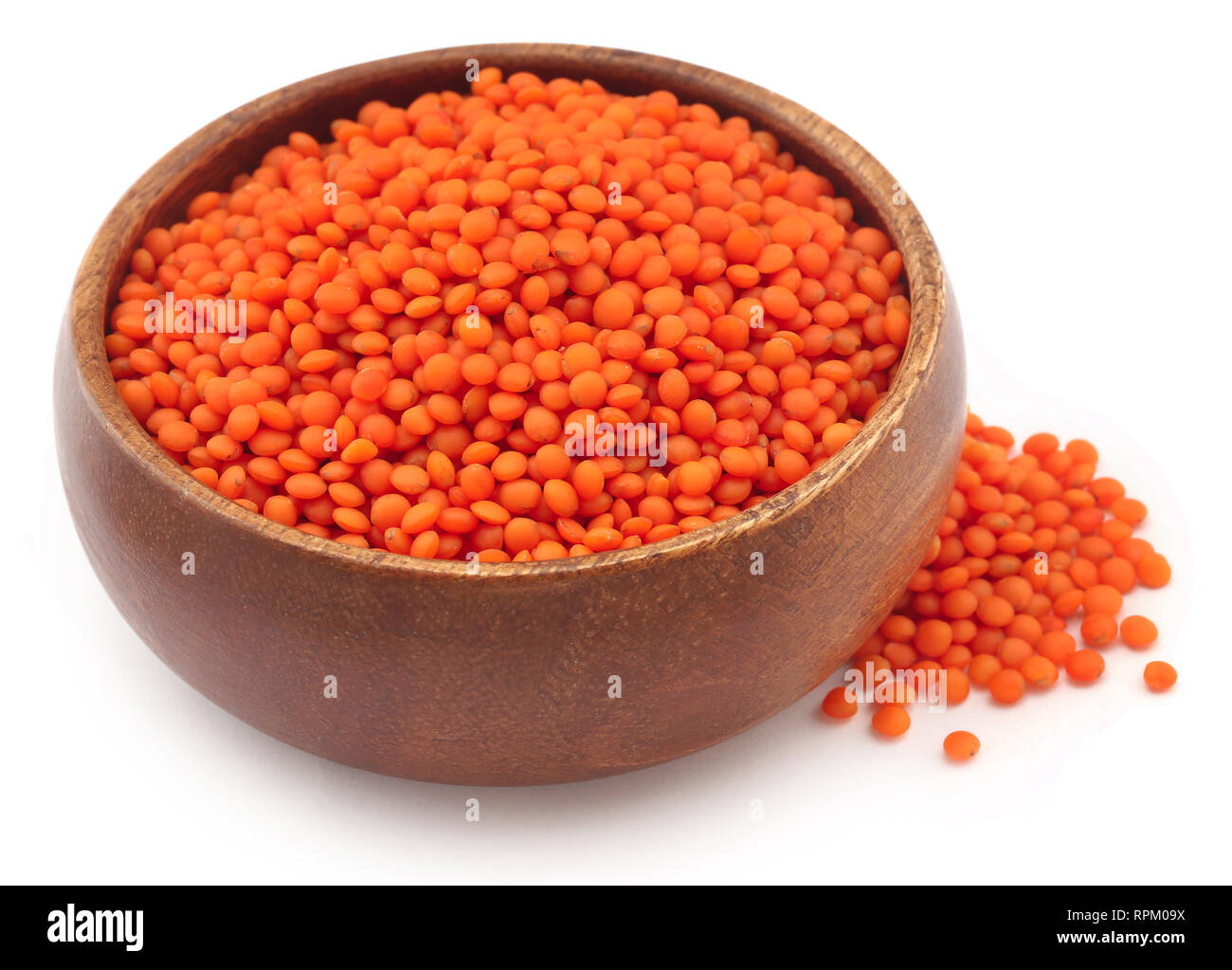 Pile of some fresh lentil in wooden bowl over white background Stock ...