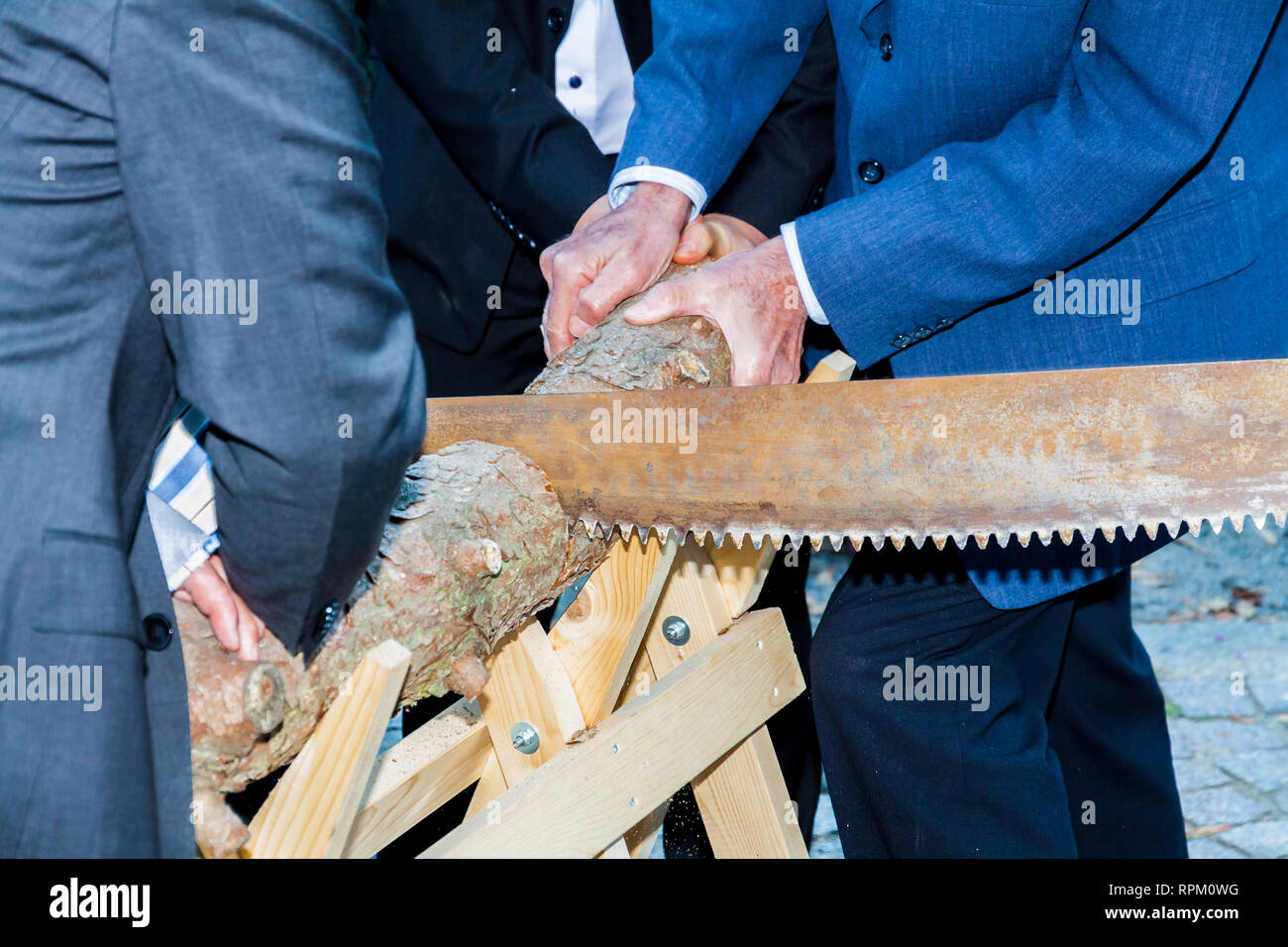 Wood cutting during wedding Stock Photo - Alamy