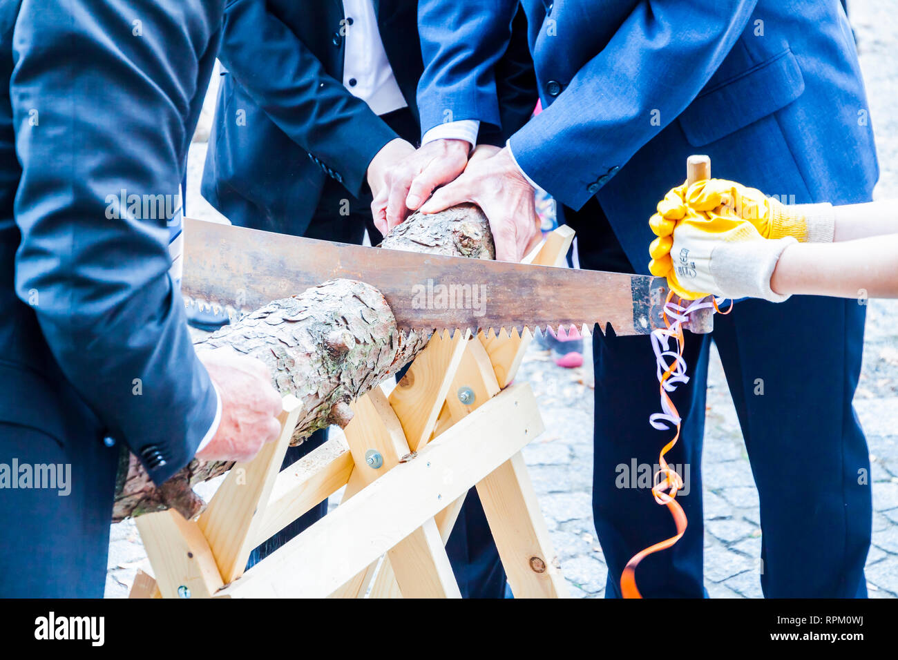 Wood cutting during wedding Stock Photo - Alamy