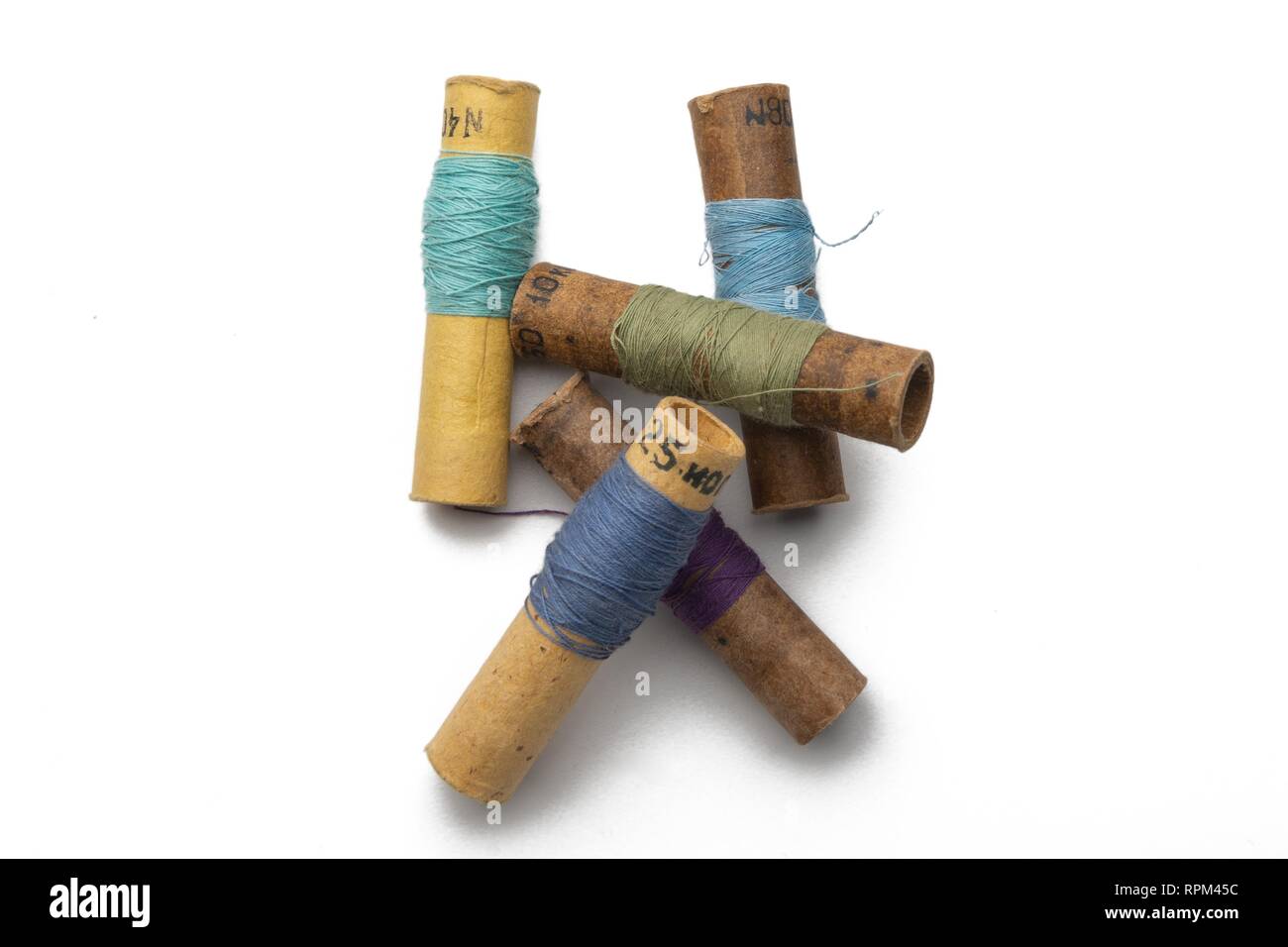 Not full used retro group of thread spools white background sewing tool ...