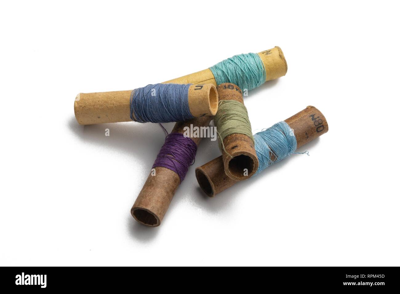 Not full used retro group of thread spools white background sewing tool ...